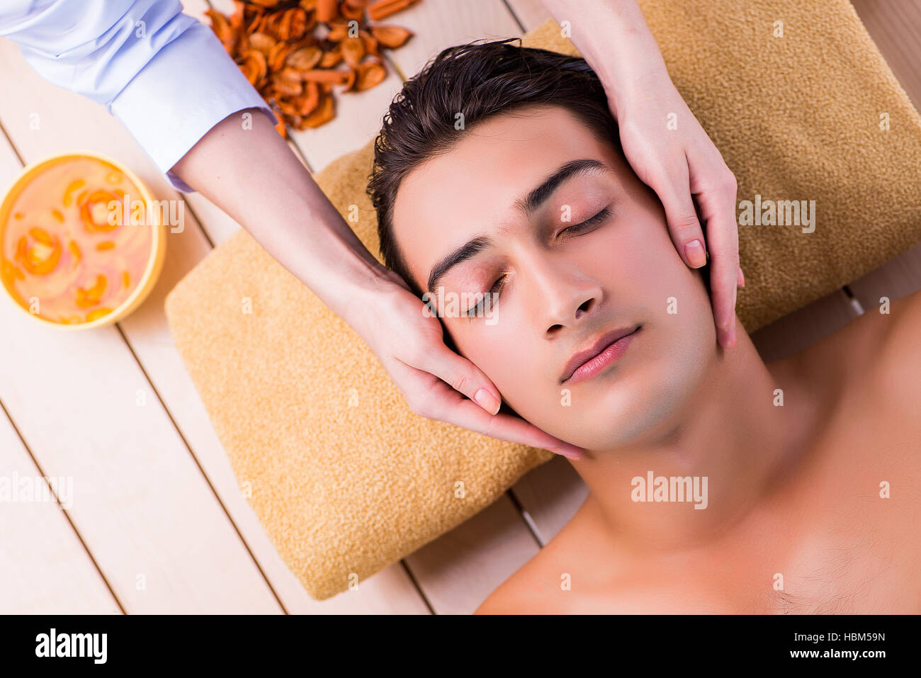 Man during massage session in spa salon Stock Photo - Alamy