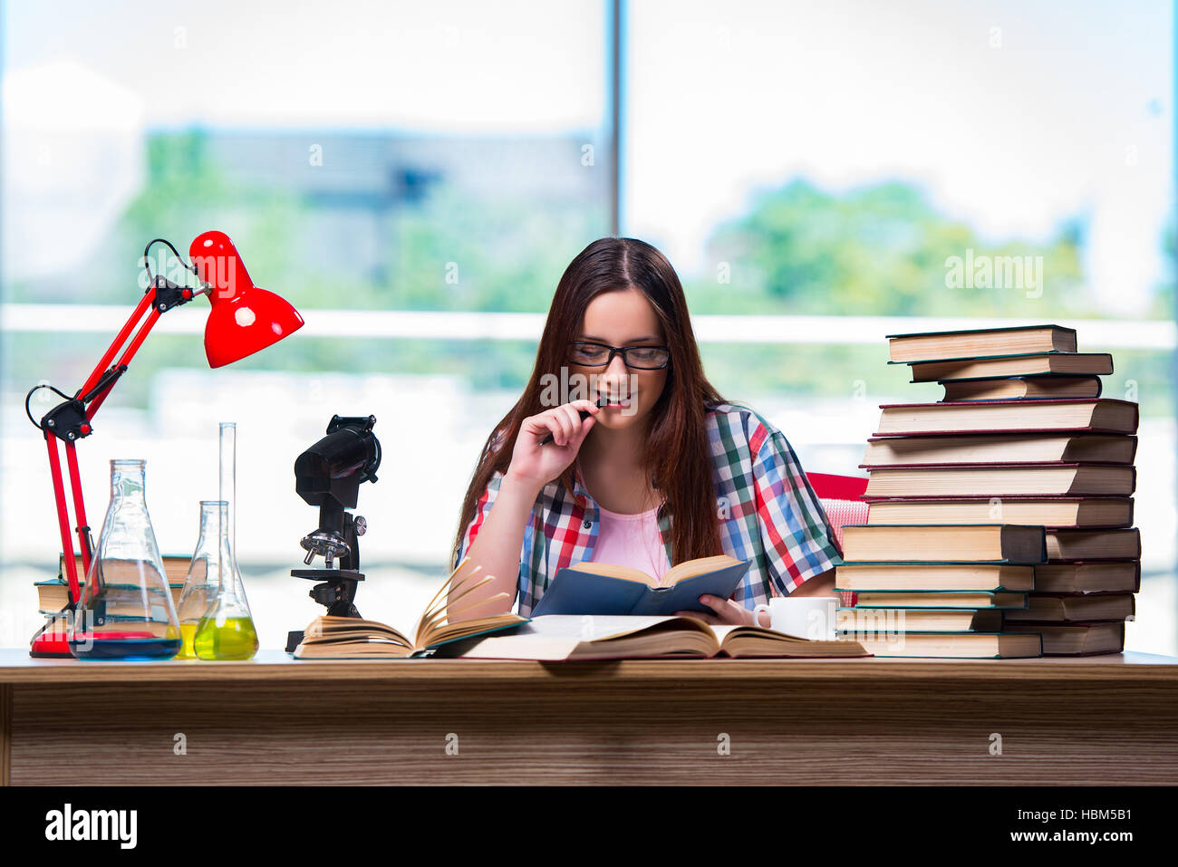 Female student preparing for chemistry exams Stock Photo - Alamy
