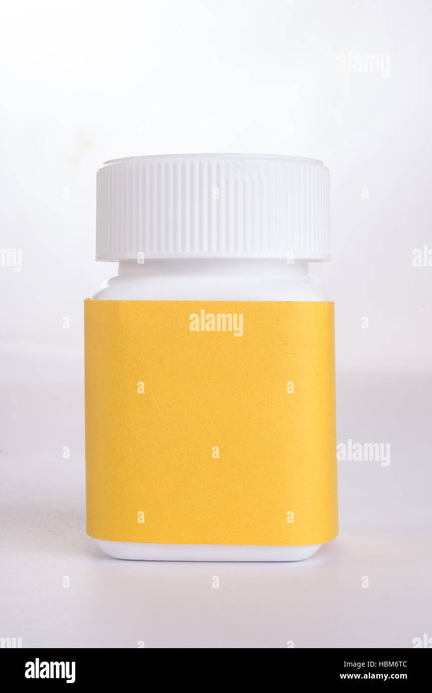 White Capsule Holder with Yellow Label Stock Photo - Alamy