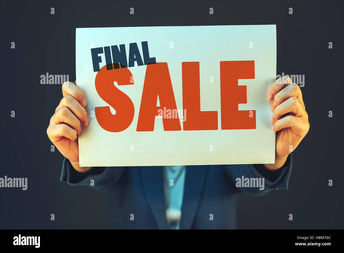 Woman holding Final Sale tag in front of her face Stock Photo - Alamy