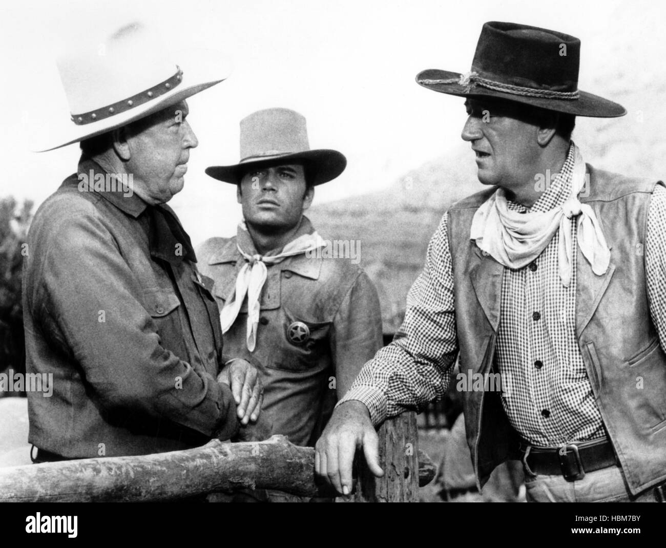 THE COMANCHEROS, from left: Bruce Cabot, Patrick Wayne, John Wayne ...
