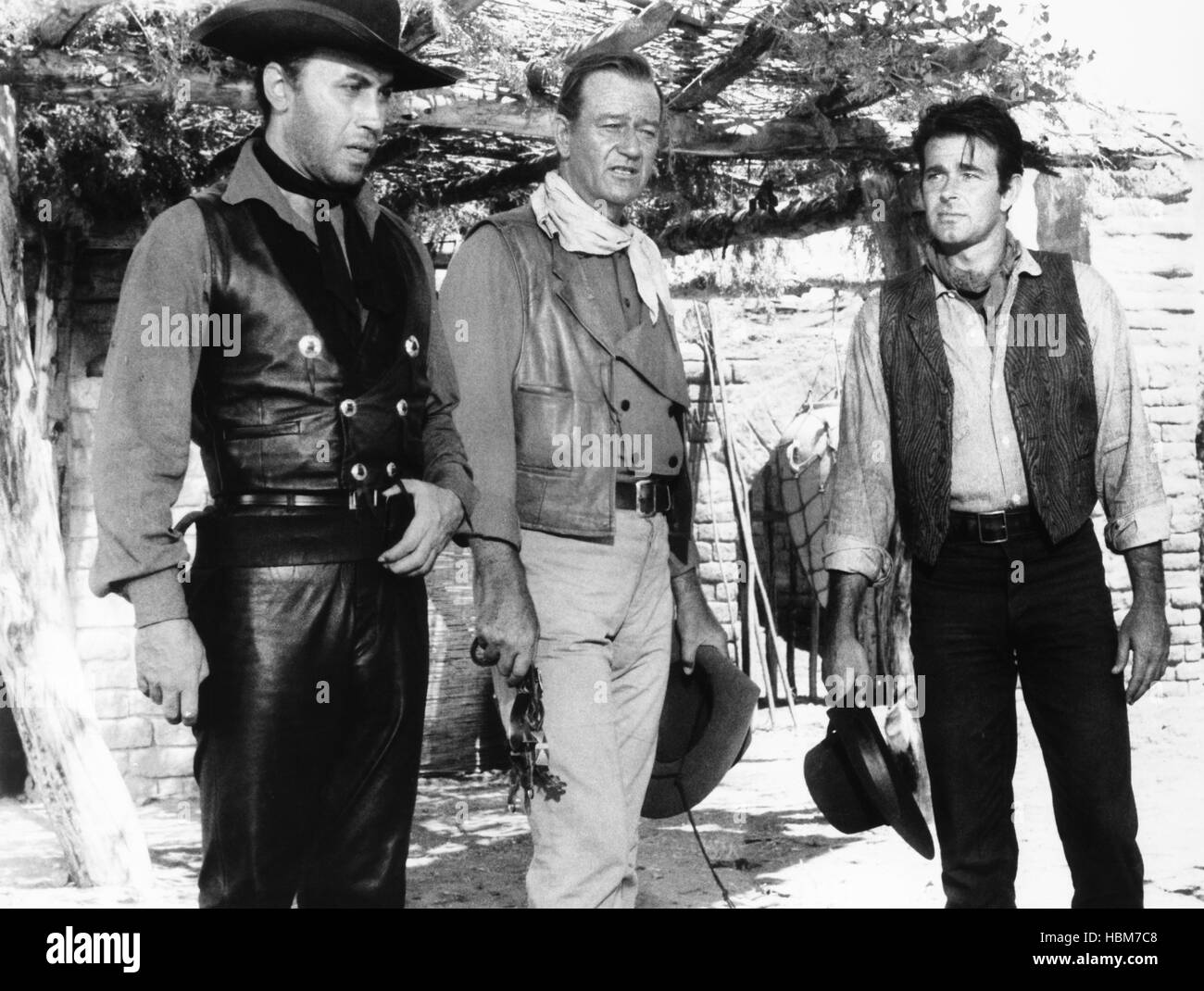 THE COMANCHEROS, from left, Michael Ansara, John Wayne, Stuart Whitman ...