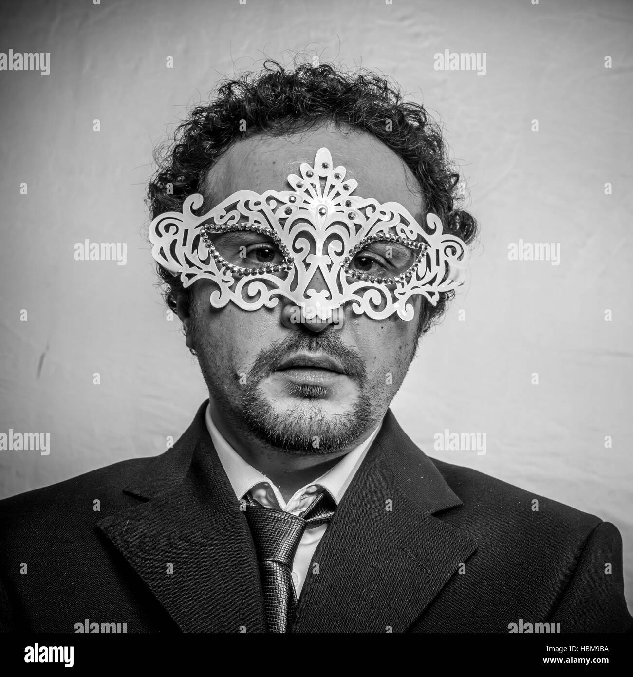 Spy, Sensual and mysterious businessman with white venetian mask Stock ...