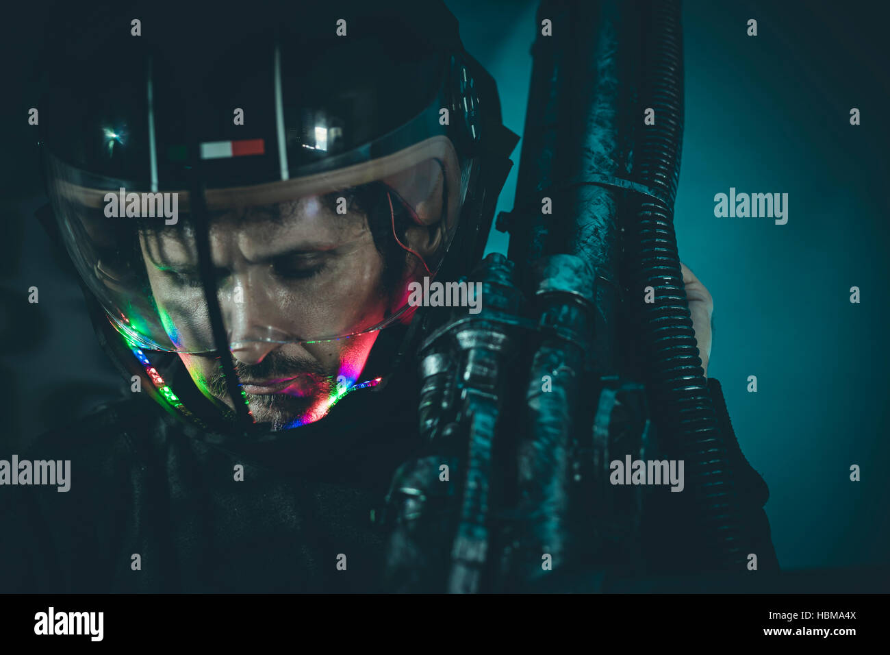 Space man with metal helmet and laser beam weapon Stock Photo - Alamy