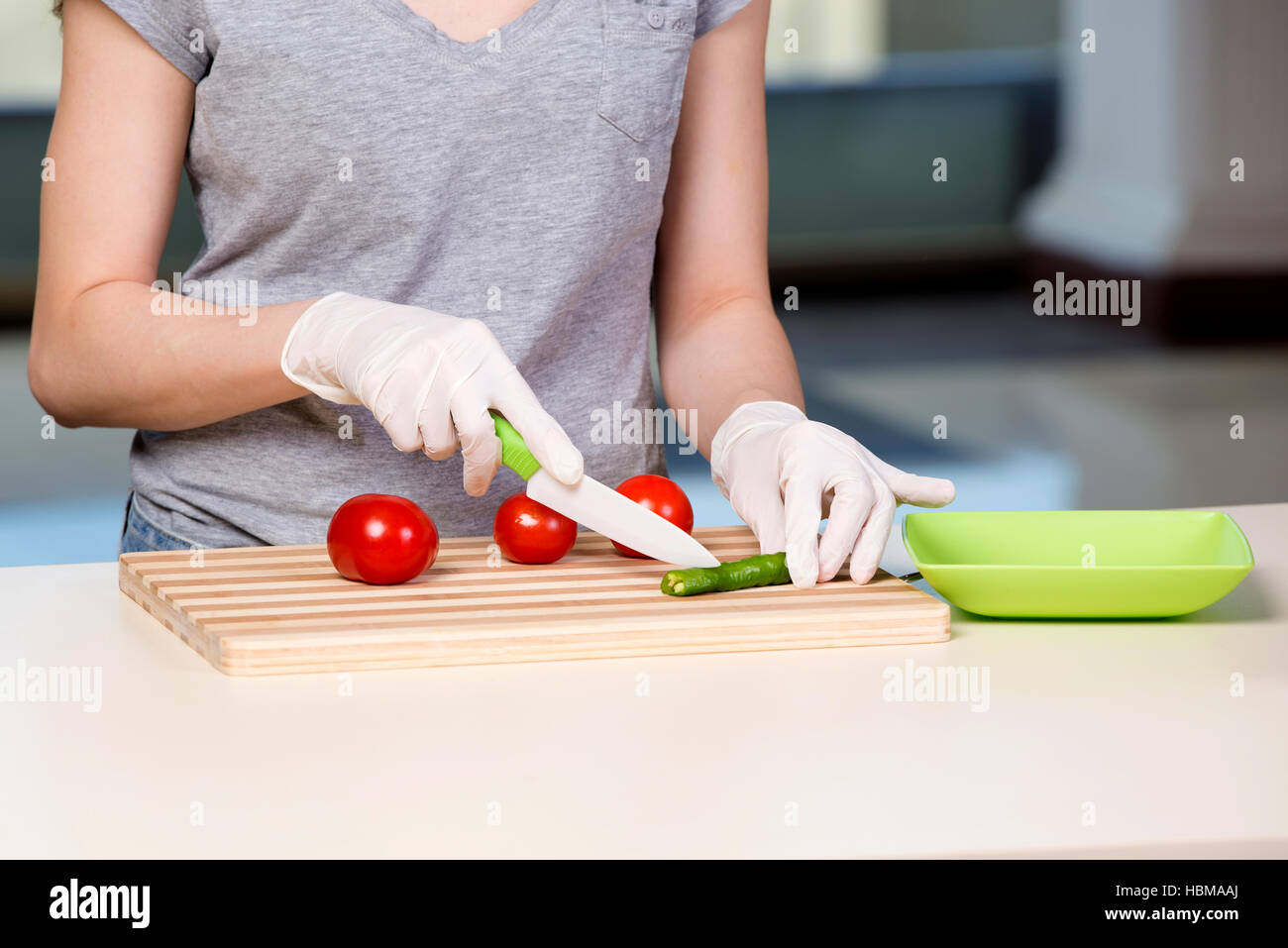 Hands of cook preparing salad Stock Photo - Alamy