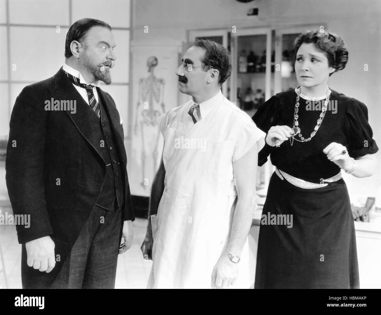 A DAY AT THE RACES, from left: Sig Ruman, Groucho Marx, Margaret Dumont ...