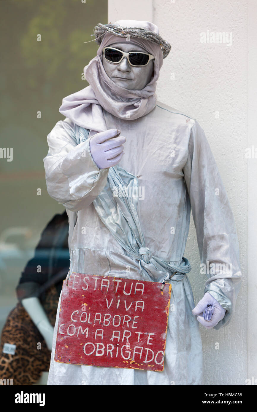 Artist in white statue begging in the street of Manaus, Brazil Stock ...