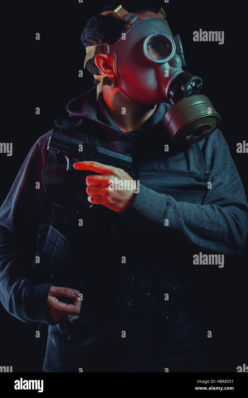 Man with gas mask and gun Stock Photo - Alamy