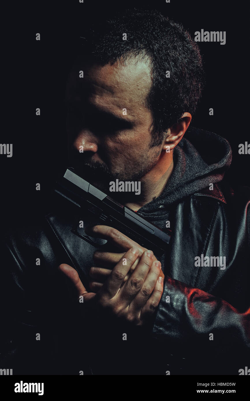 Robber with gun. Man in suit draws vintage handgun Stock Photo - Alamy