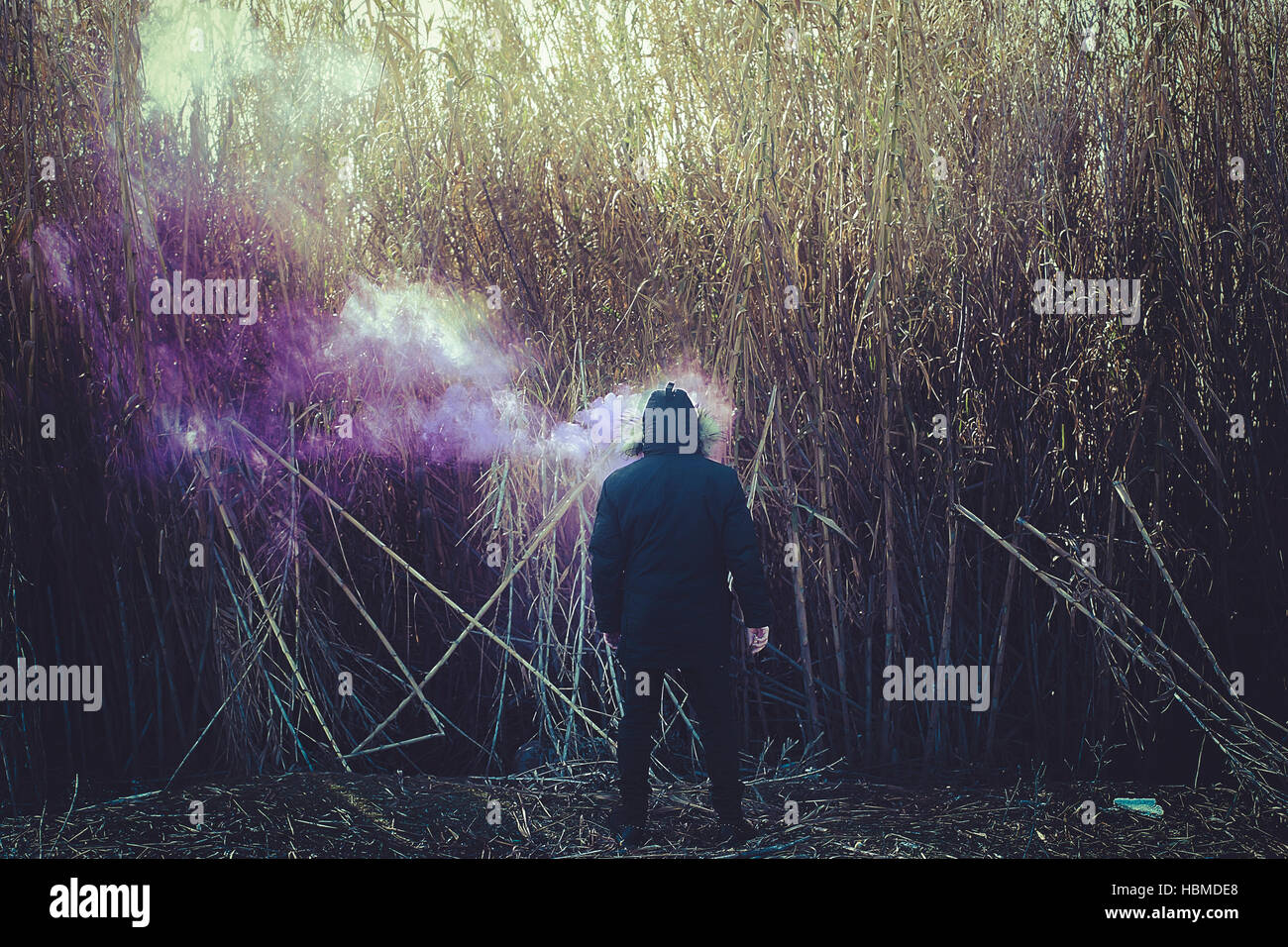 Loneliness and depression, solitary man with colored smoke Stock Photo ...