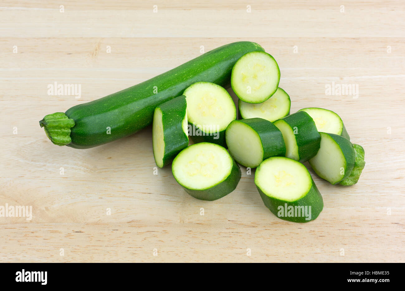 Italian squash whole and cut into pieces on an wood cutting board Stock ...
