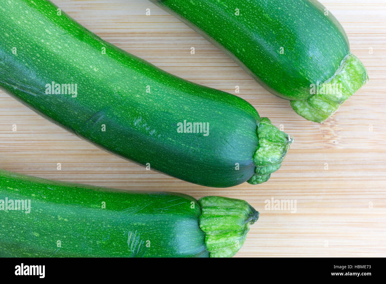 Italian squash on a wood cutting board top close view Stock Photo - Alamy