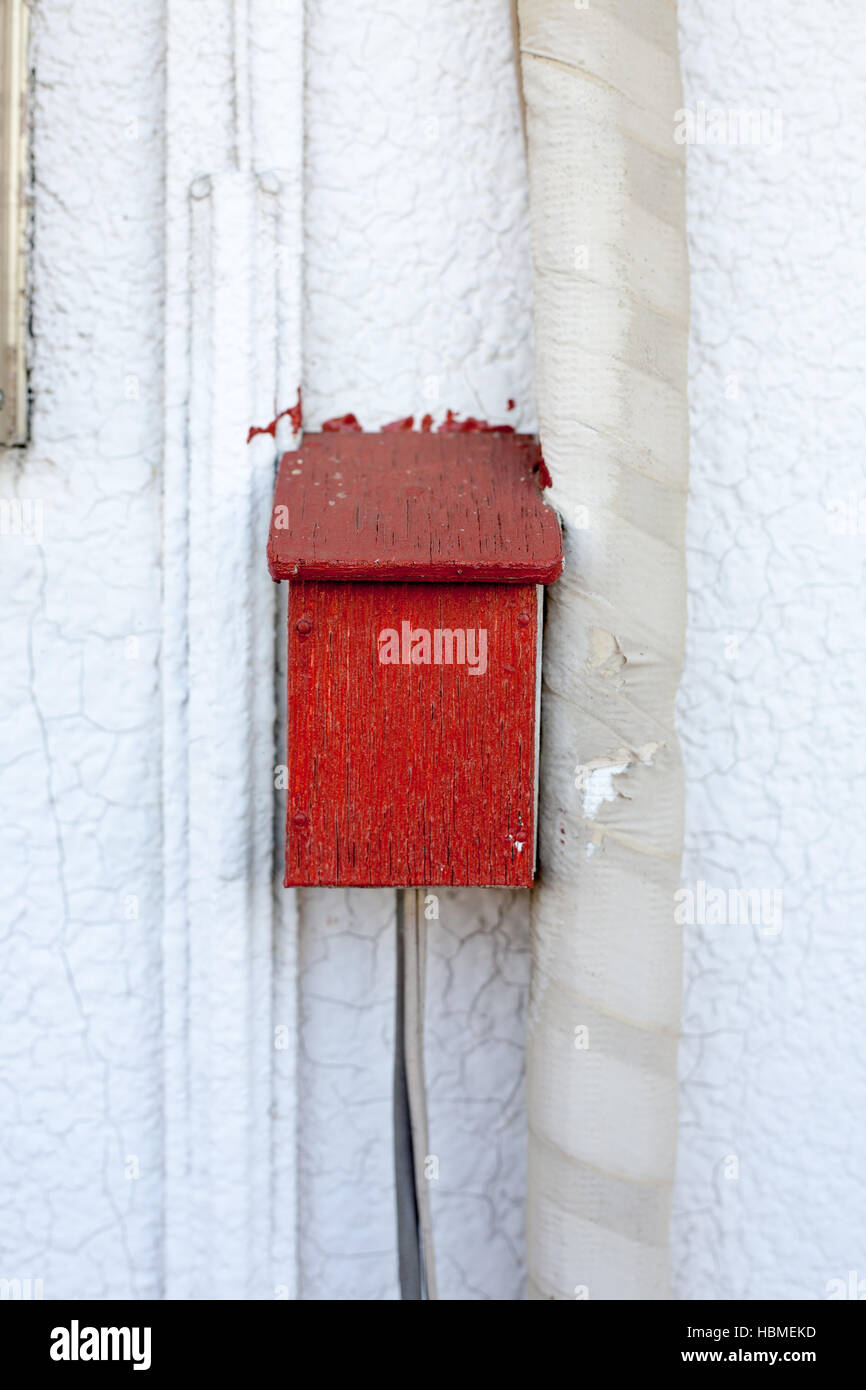 Handmade wooden device box attached on the exterior wall Stock Photo ...