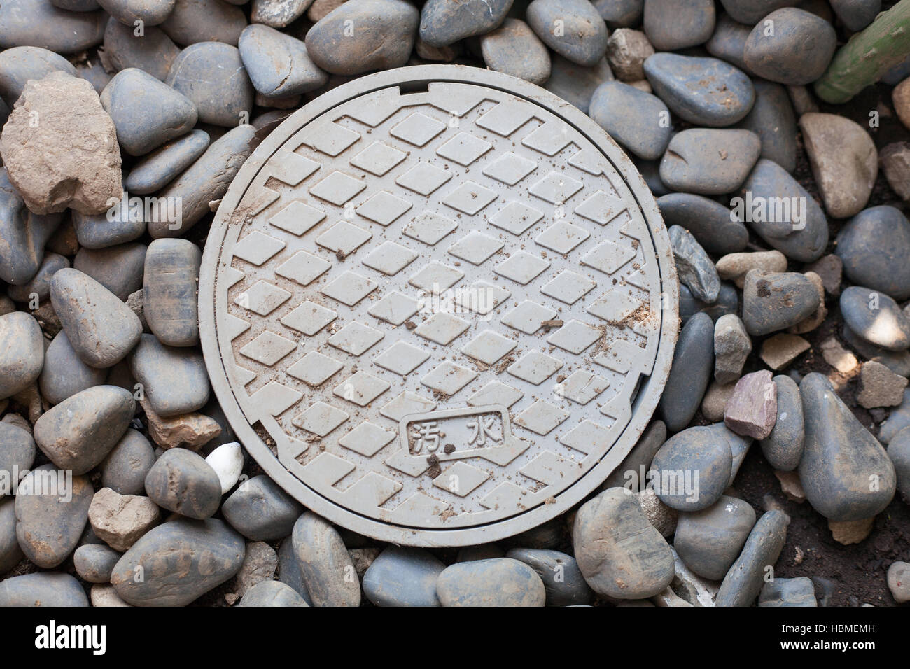 A gray plastic lid of the sewer in Japan Stock Photo - Alamy