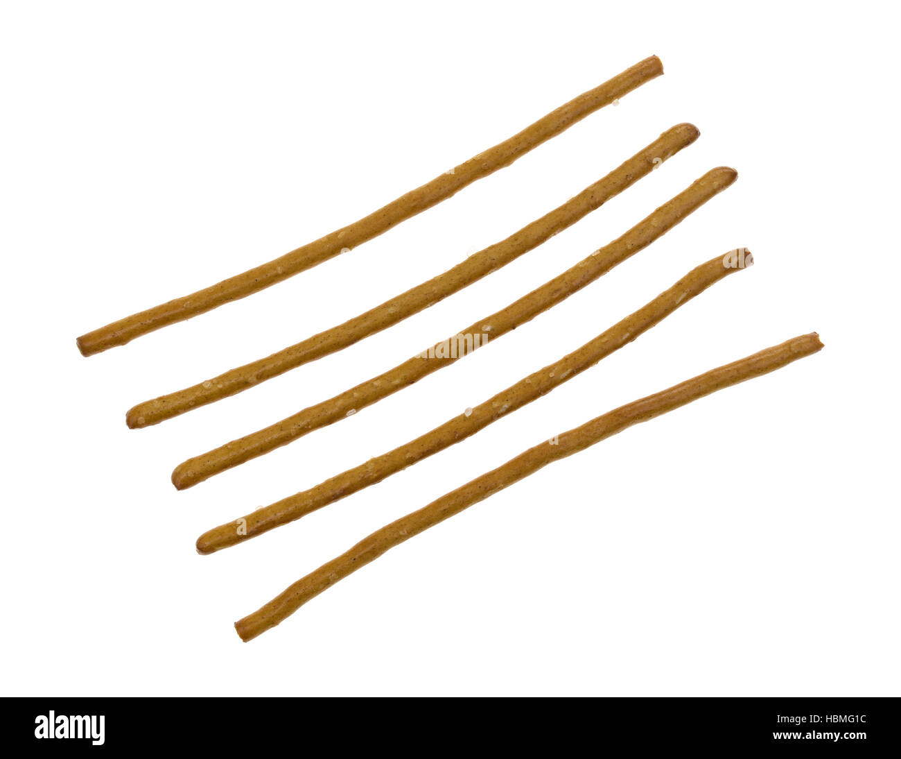 Top view of five salted whole wheat bretzel sticks isolated on a white ...