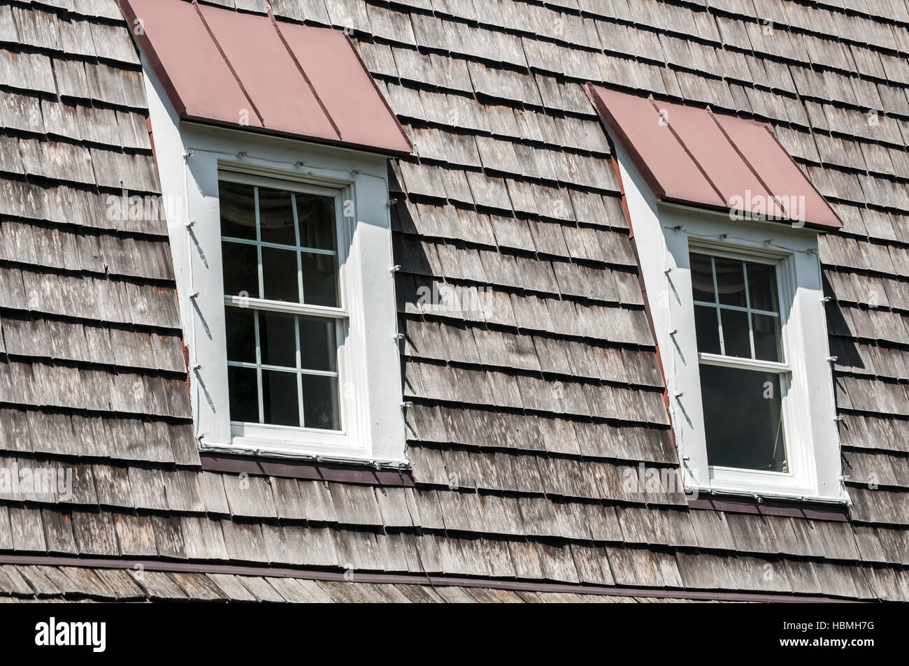 Two attic windows of house roof Stock Photo - Alamy