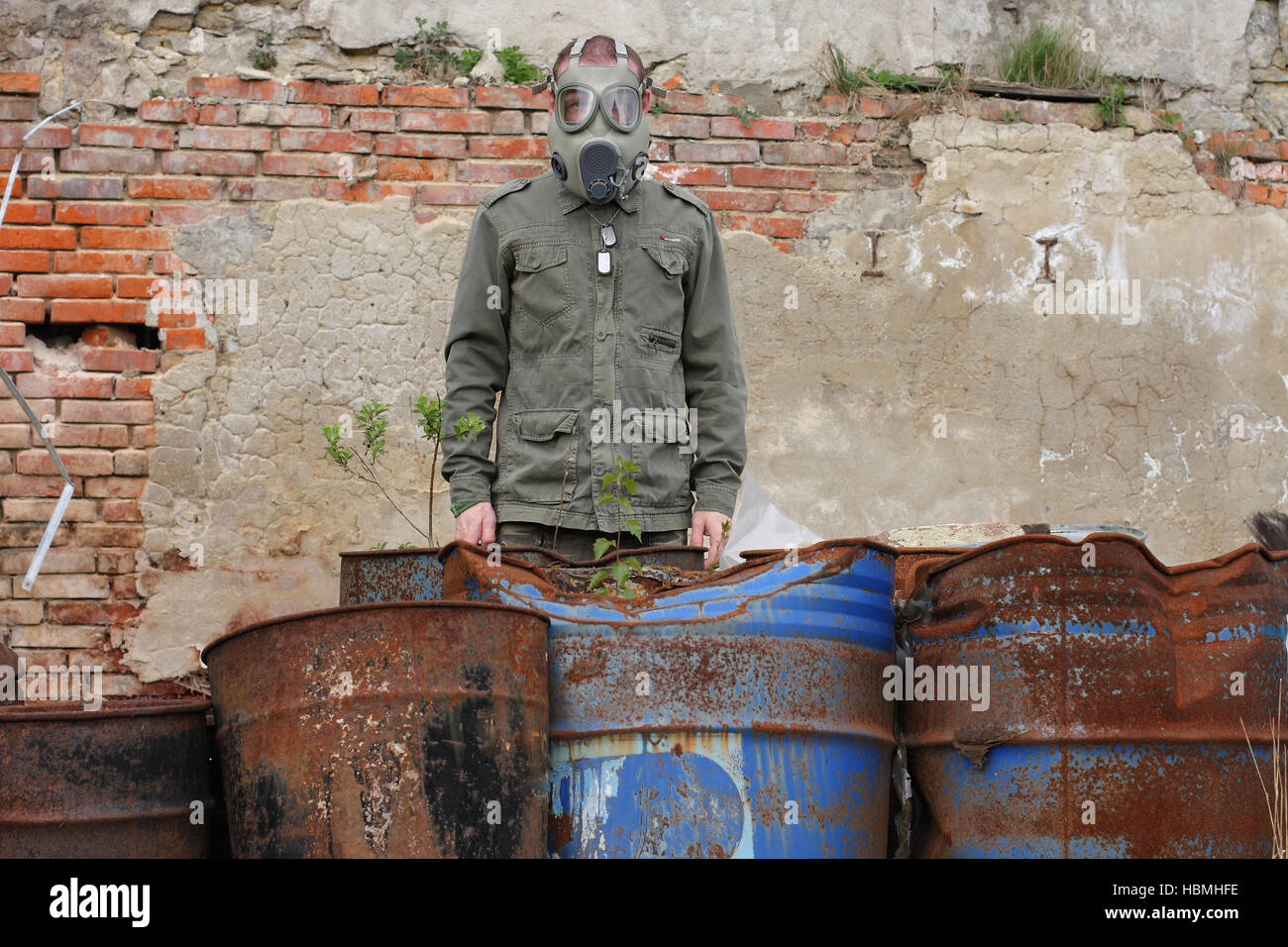 Man with gas mask and green military clothes after chemical disaster ...