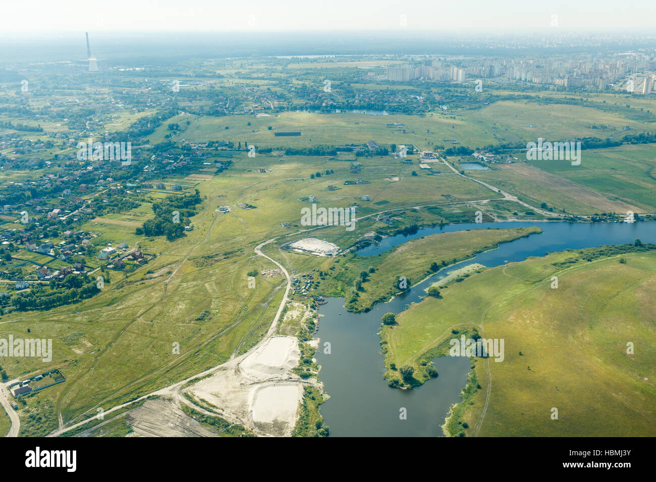 Aerial view of countryside with river near a big city Stock Photo - Alamy
