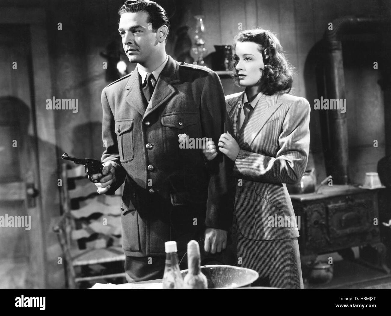 DARK MOUNTAIN, from left: Robert Lowery, Ellen Drew, 1944 Stock Photo ...