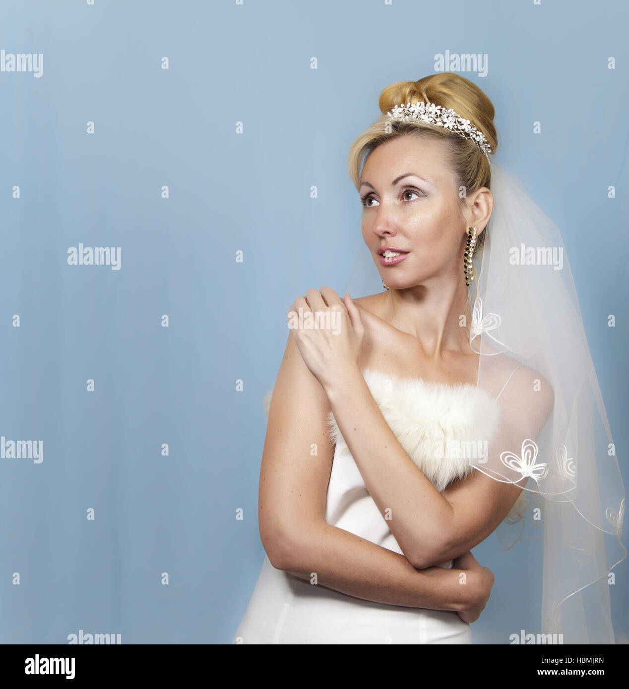 The happy bride on a blue background Stock Photo - Alamy