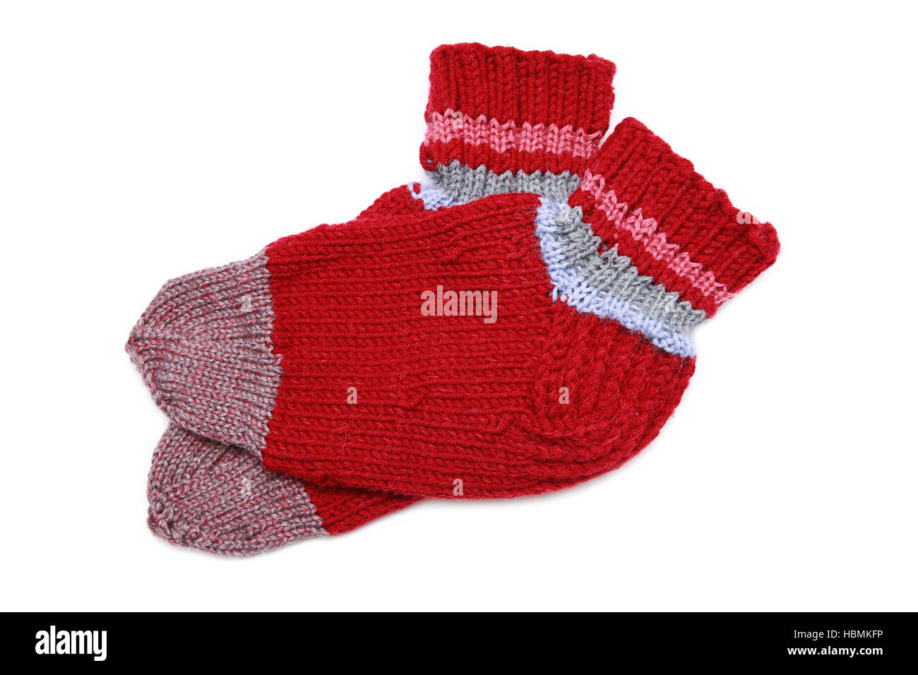 Knitted wool red socks on a white background Stock Photo - Alamy