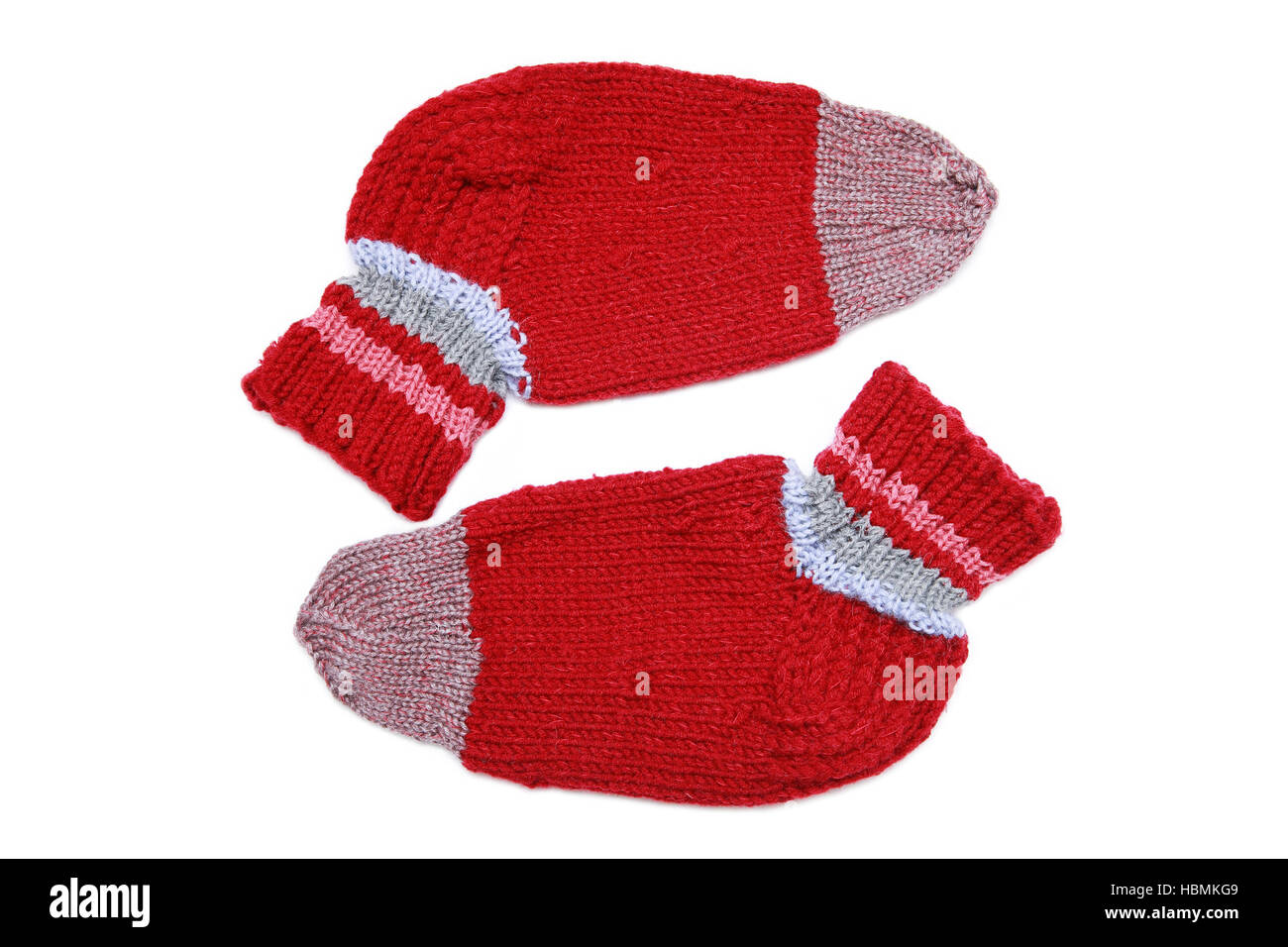 Knitted wool red socks on a white background Stock Photo - Alamy