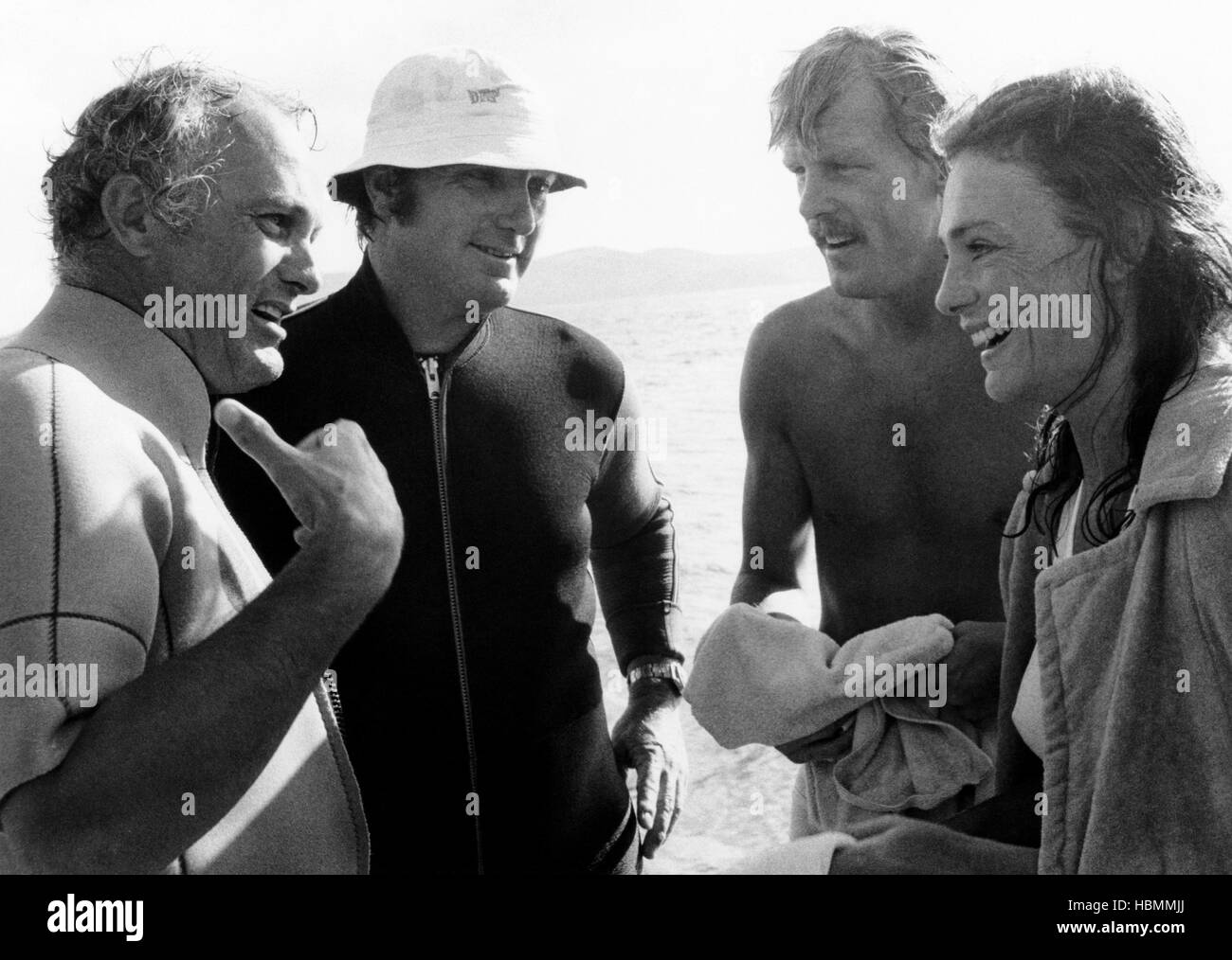 THE DEEP, from left: director Peter Yates, Robert Shaw, Nick Nolte ...