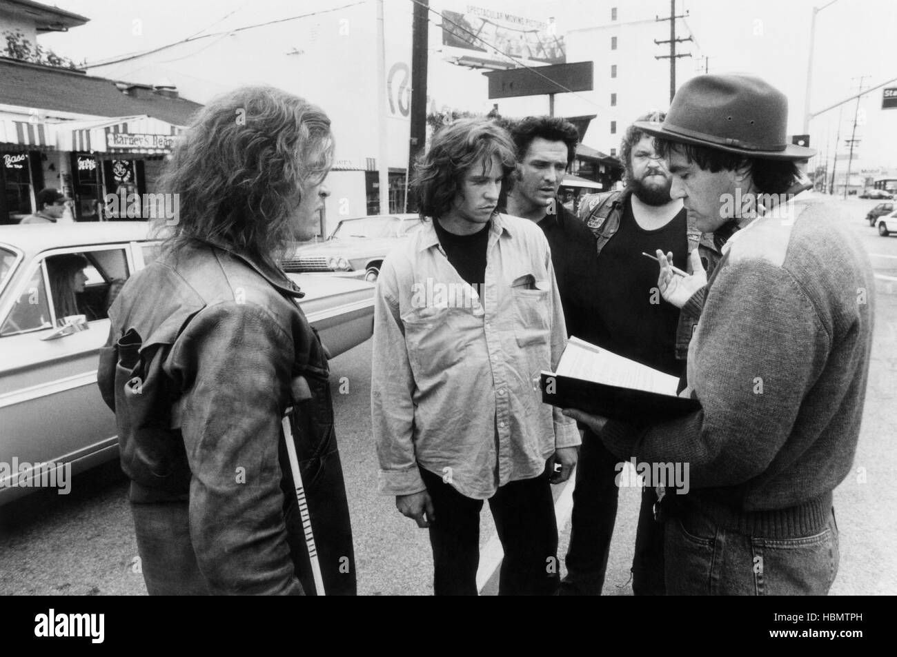 THE DOORS, Val Kilmer, (center), director Oliver Stone, (right), 1991 ...