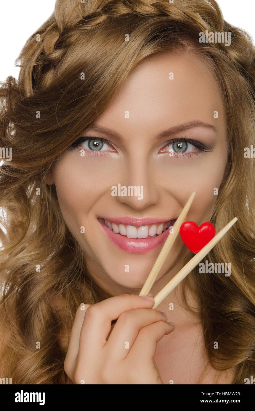beautiful woman holding heart with chopsticks Stock Photo - Alamy