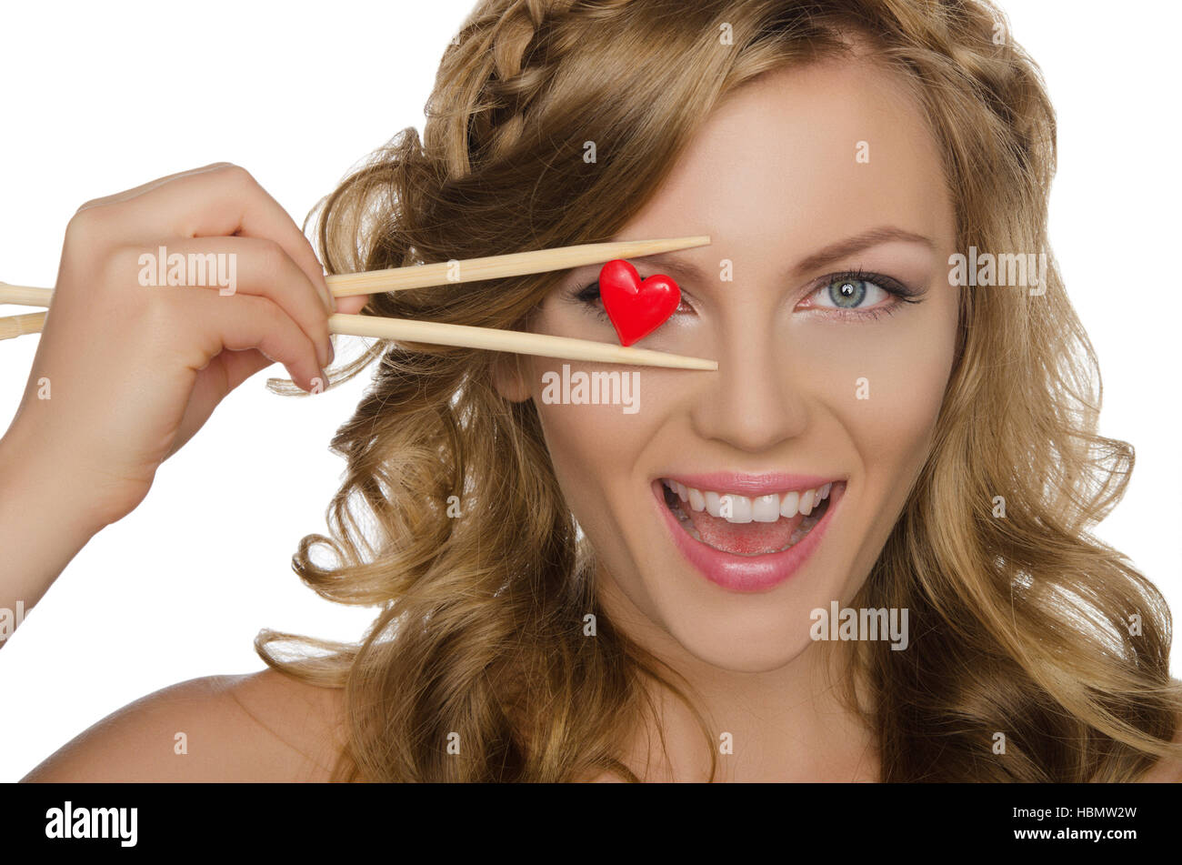 young woman holding heart with chopsticks Stock Photo - Alamy
