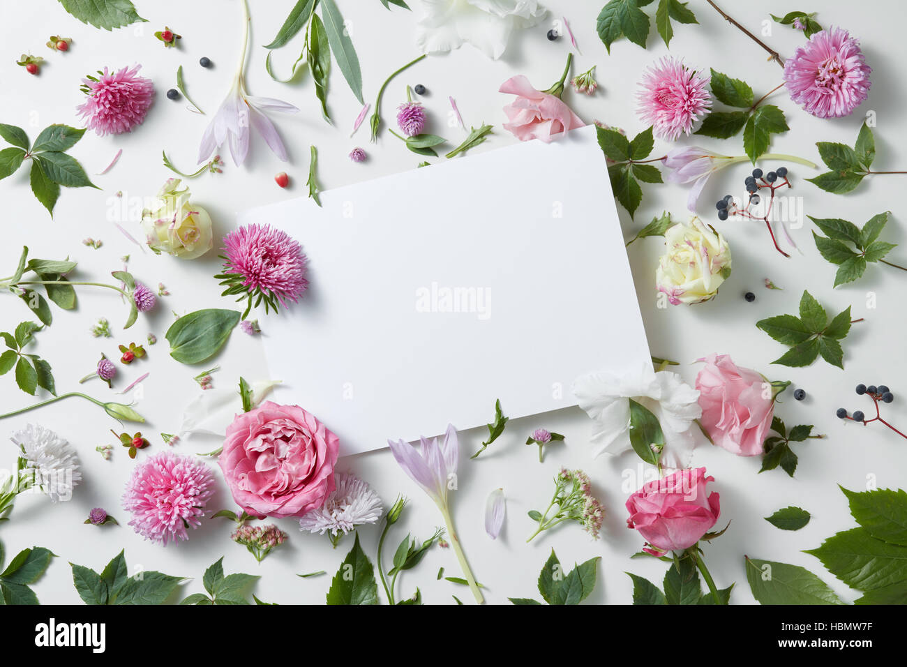 flowers with empty white notebook Stock Photo - Alamy