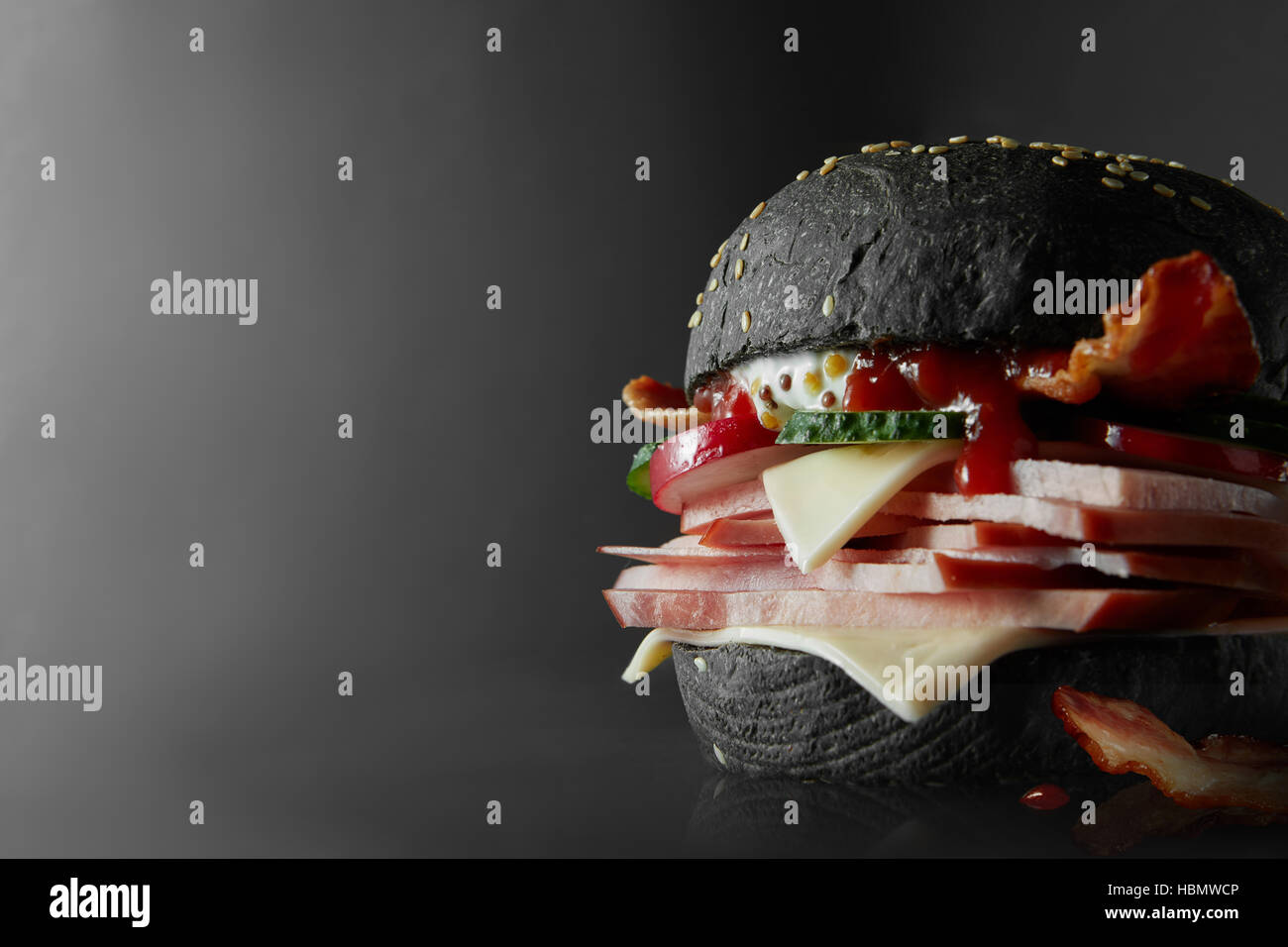 Black Burger with Cheese Stock Photo - Alamy