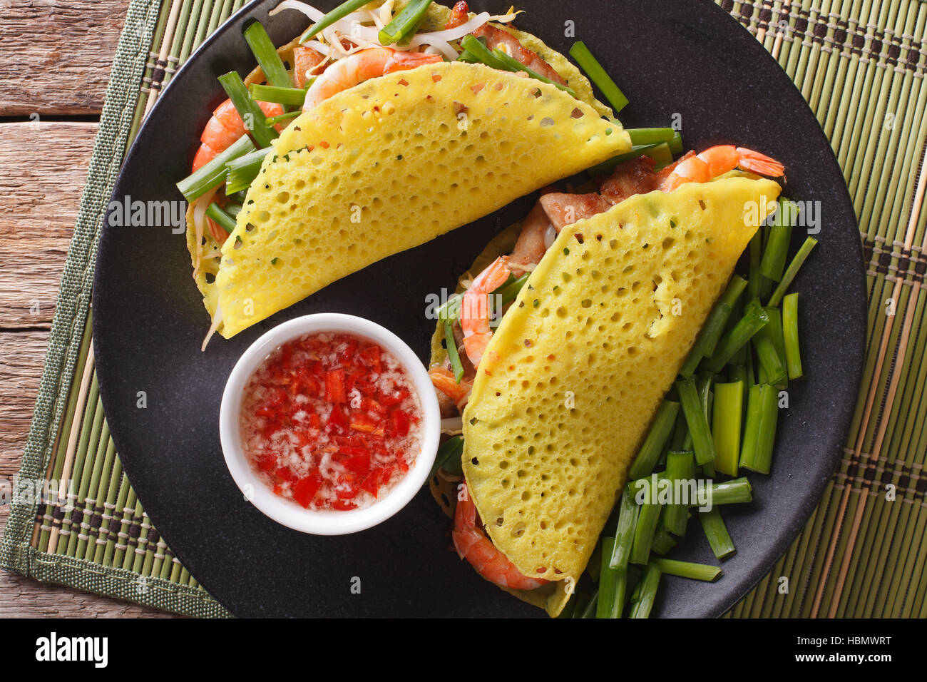 Vietnamese Banh Xeo crepes stuffed with pork, shrimp and bean sprouts ...