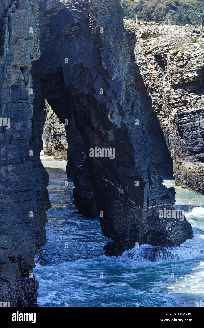 Natural arches on beach Stock Photo - Alamy
