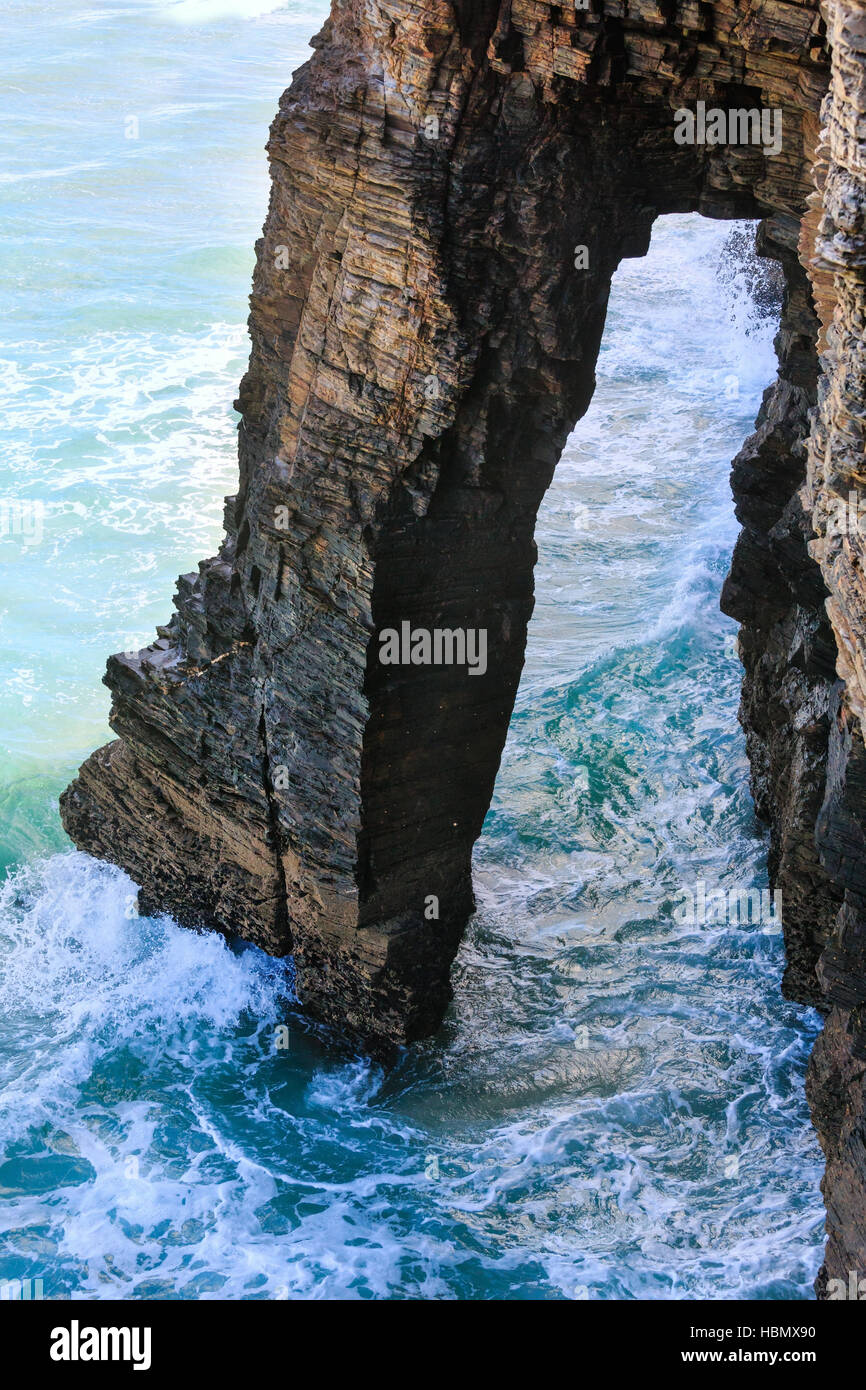 Natural arches on beach Stock Photo - Alamy