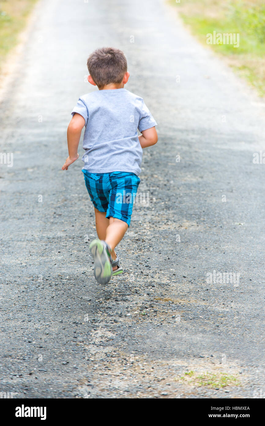 child running along a country road Stock Photo - Alamy