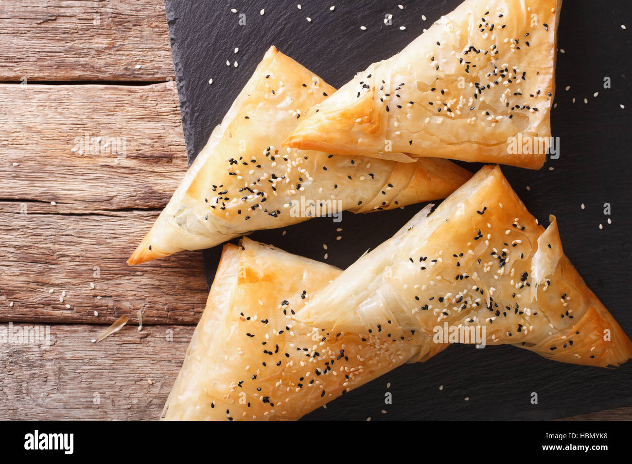 Freshly baked filo pastry with chicken, spinach and cheese close-up on ...