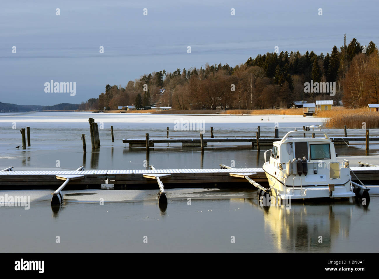 Lonely motorboat and frozen sea Stock Photo - Alamy