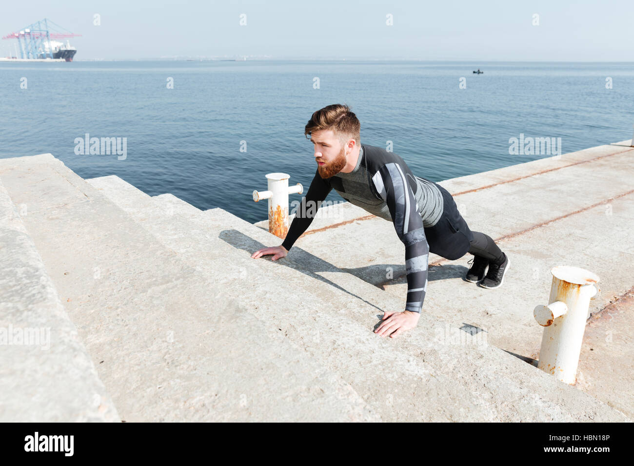 Male doing push ups near the sea. on stairs. top view Stock Photo - Alamy