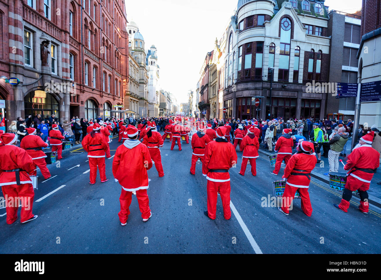 Katumba drummers encourage runners 2016 Santa Dash in Liverpool which broke the world record for ...