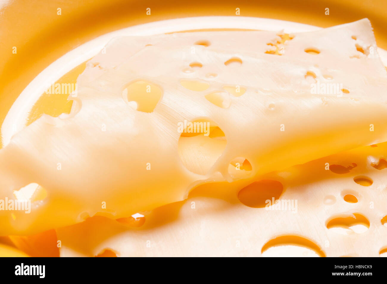 Emmental cheese sliced Stock Photo - Alamy