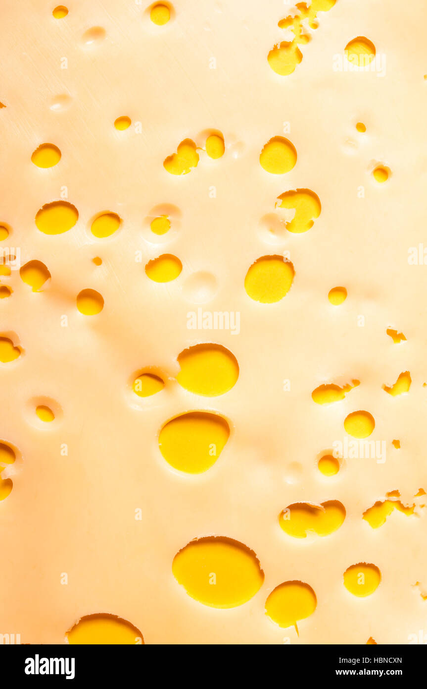 close up of an Emmental cheese slice Stock Photo - Alamy