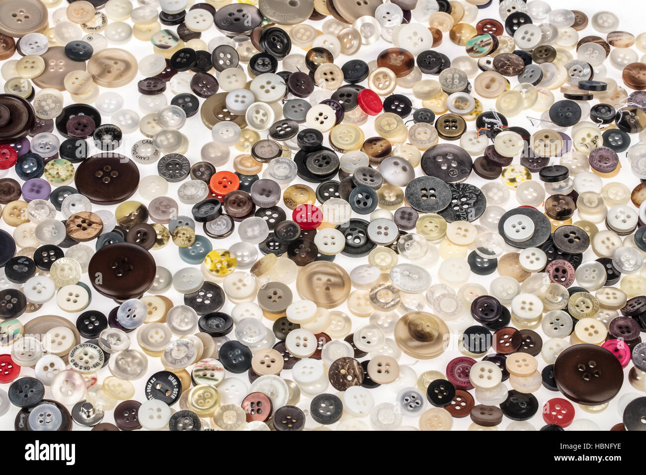 Heap Of Tailor Buttons On White Stock Photo - Alamy
