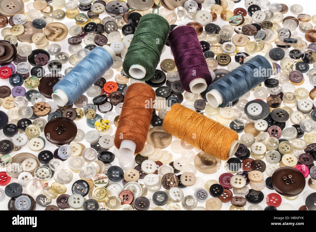 Buttons And Threads On White Stock Photo - Alamy