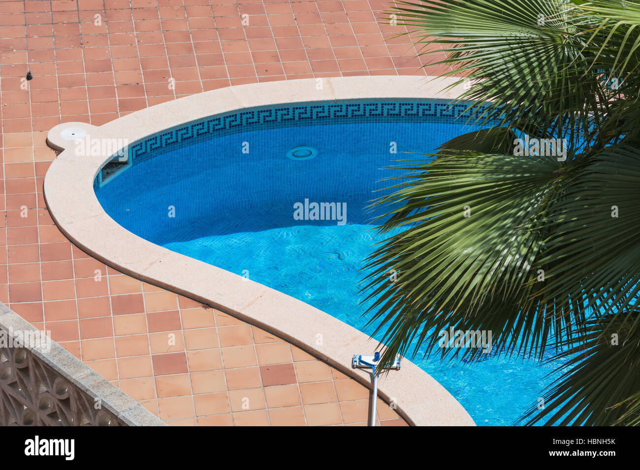 Outdoor pool with blue tiles Stock Photo - Alamy