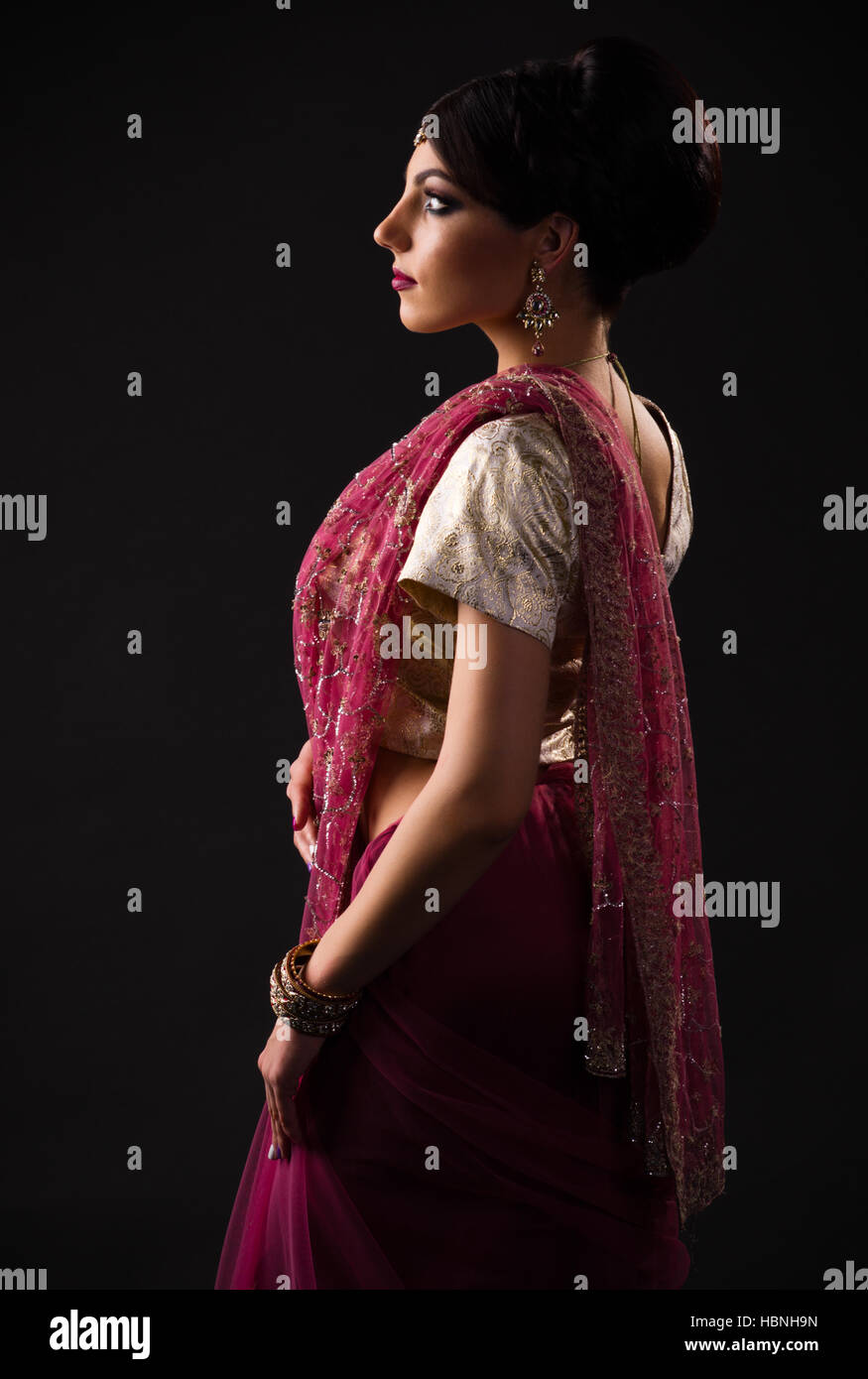 Young indian woman on grey Stock Photo - Alamy