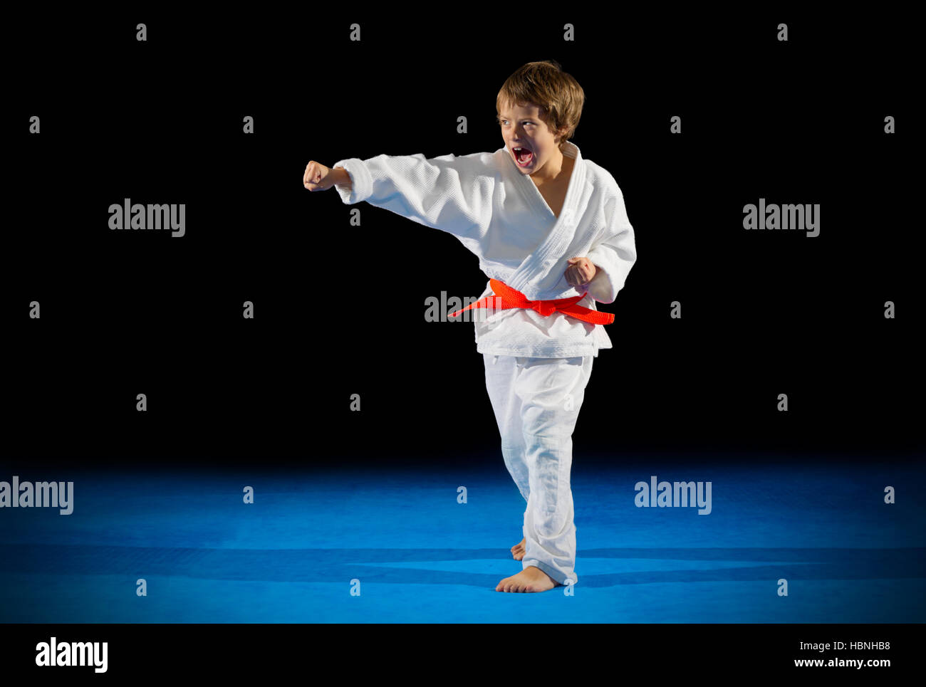 Little boy martial arts fighter isolated Stock Photo - Alamy
