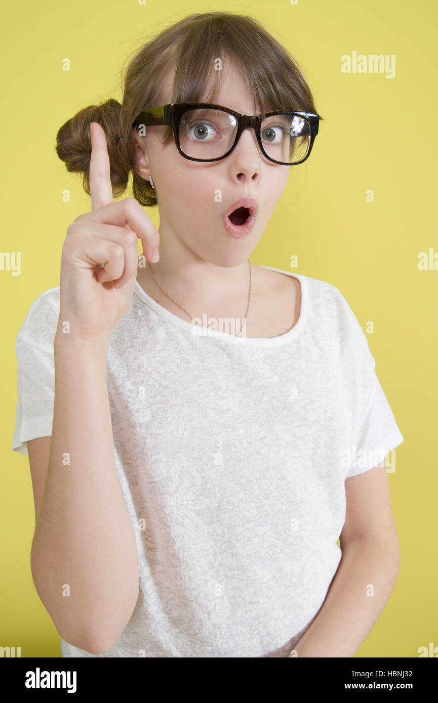 Girl with a raised finger Stock Photo - Alamy