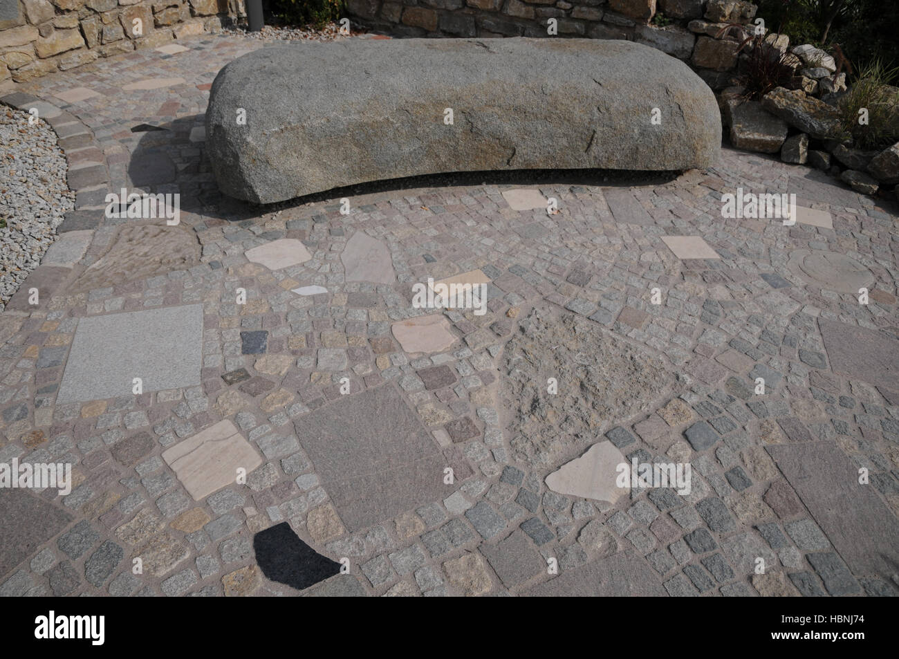 Garden with colored pavement Stock Photo - Alamy