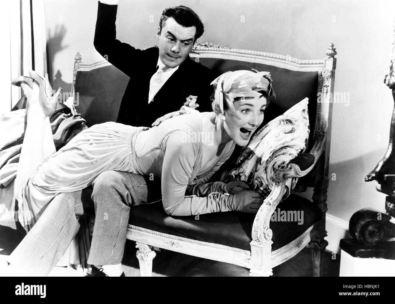 DOCTOR AT LARGE, Dirk Bogarde, spanking Barbara Murray, 1957 Stock ...